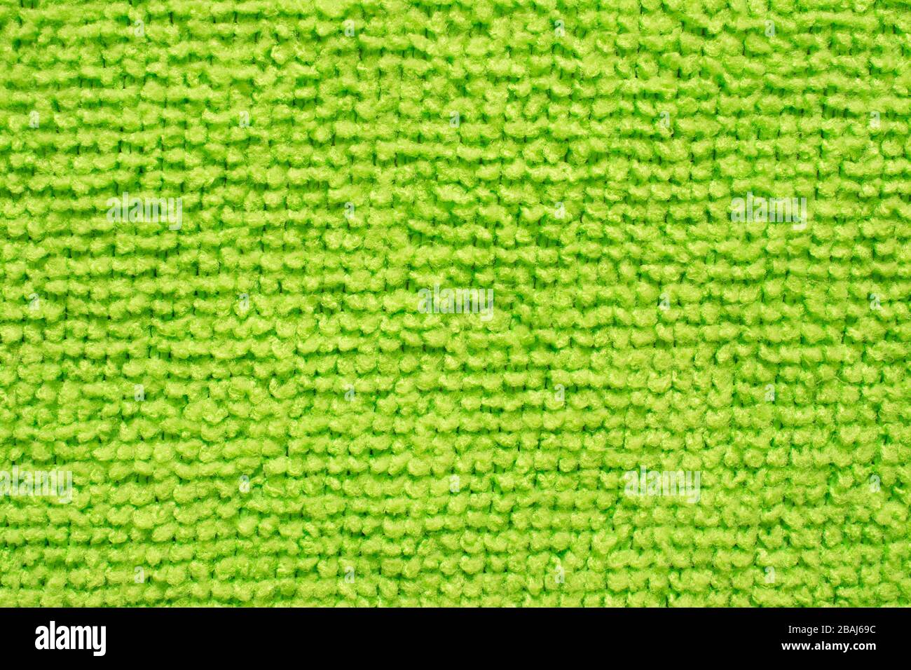 Surface of green microfiber cloth, macro textile pattern background ...