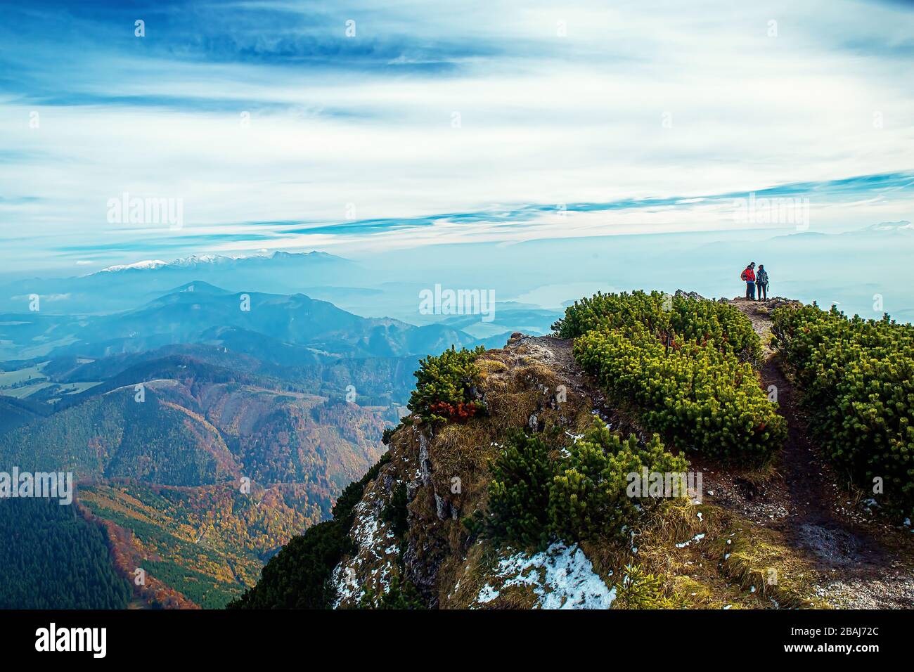 Beautiful landscape and snow mountain and two tourist Stock Photo - Alamy