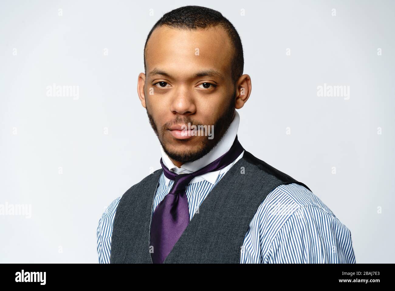 African-American man face portrait over grey background Stock Photo - Alamy