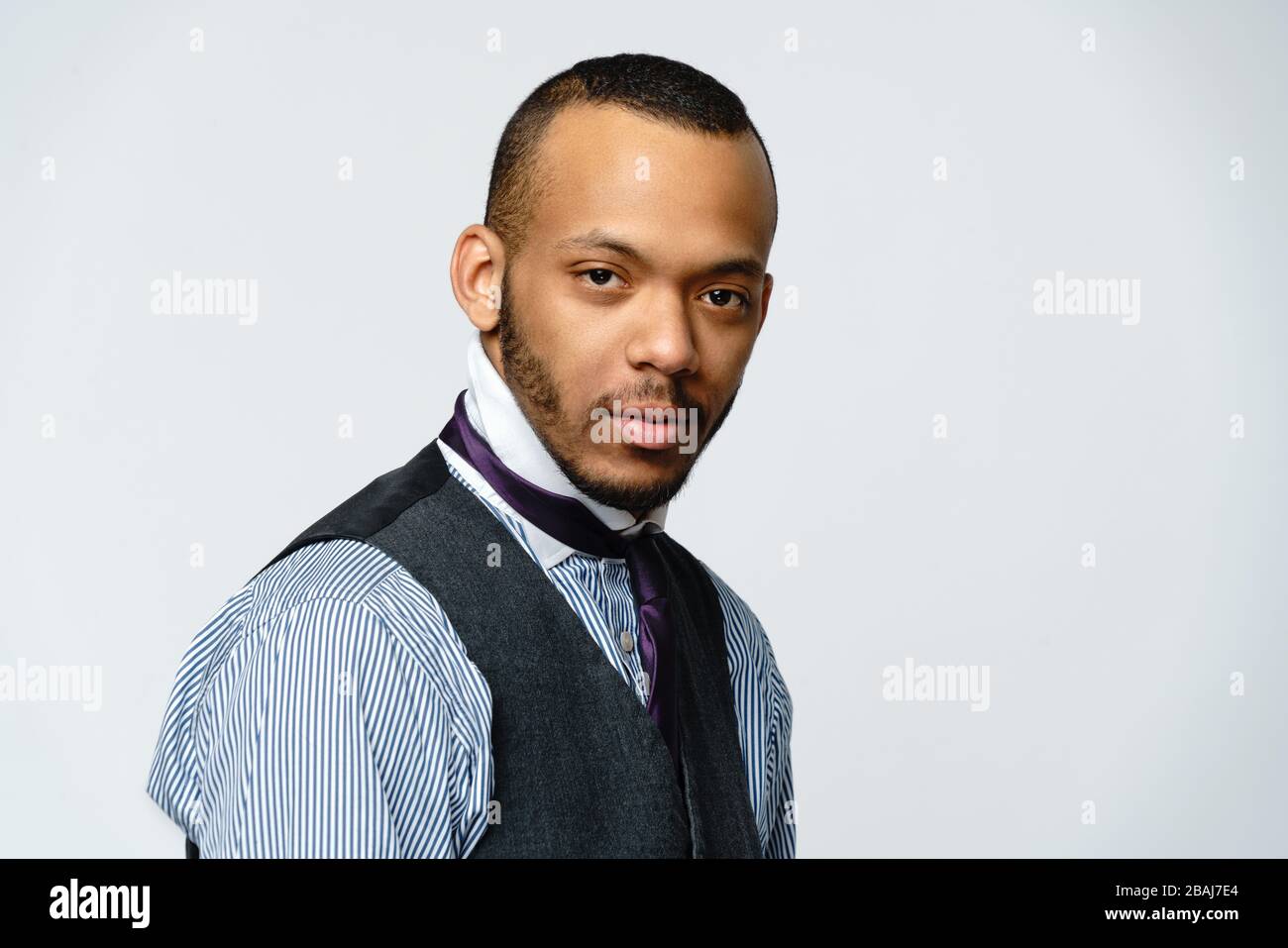 African-American man face portrait over grey background Stock Photo - Alamy