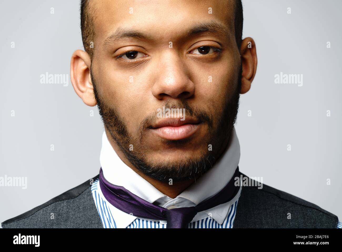 African-American man face portrait over grey background Stock Photo - Alamy