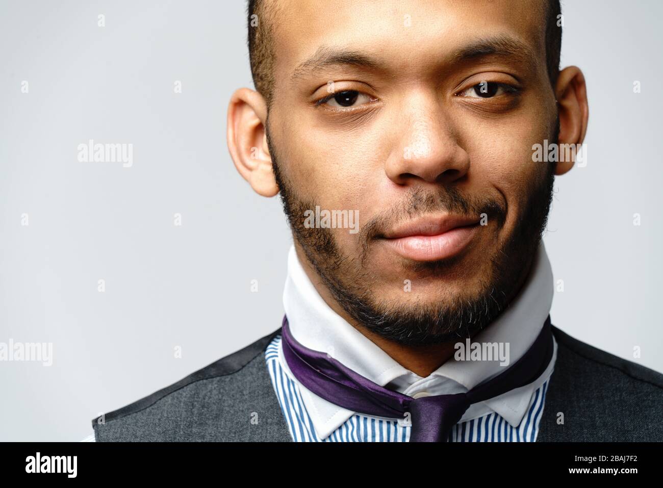 African-American man face portrait over grey background Stock Photo - Alamy