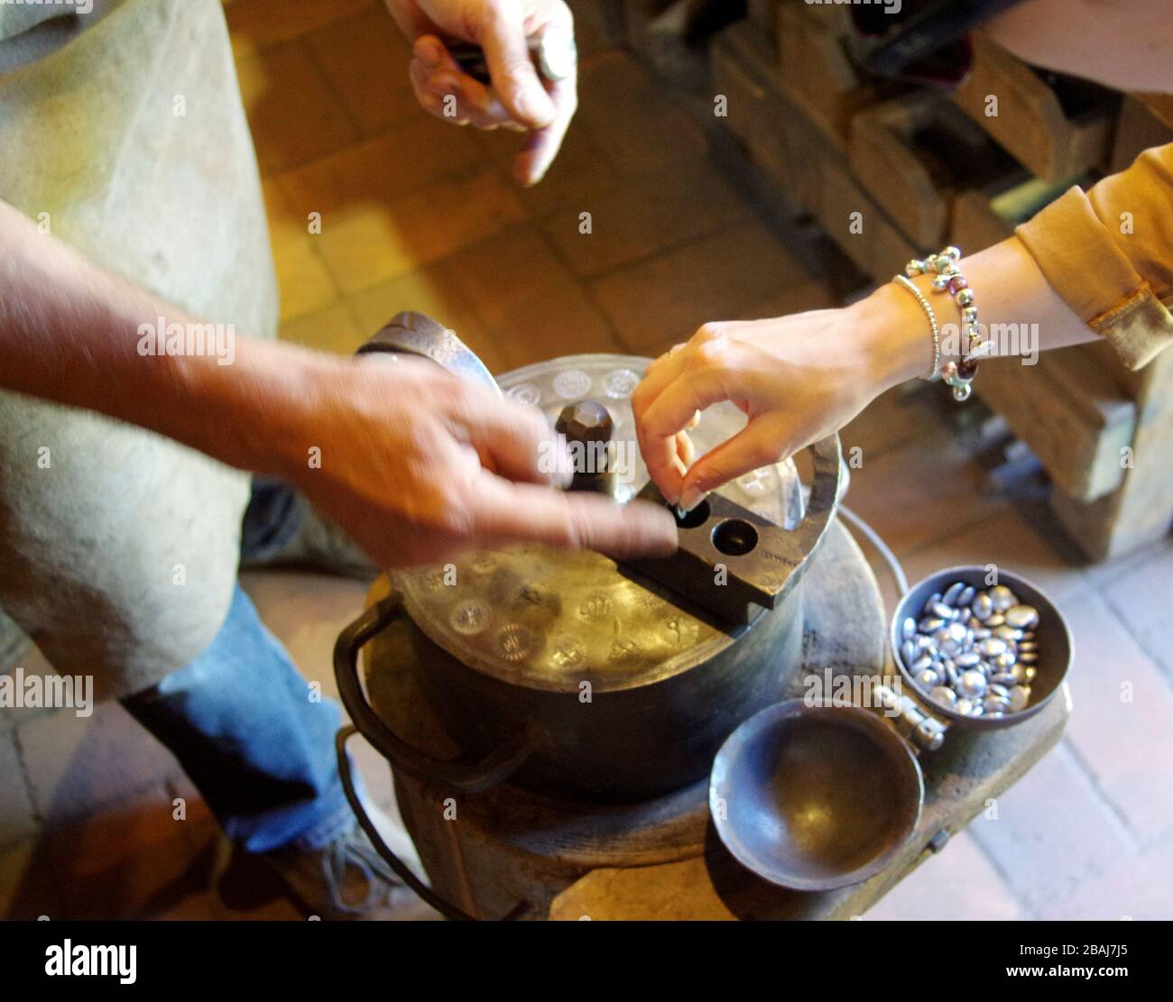 Production of aluminum coins, How to make coin Stock Photo - Alamy