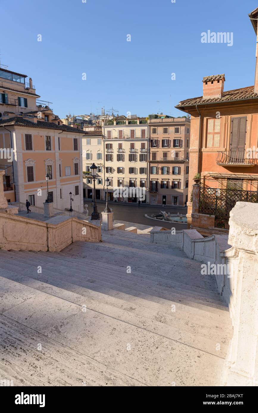 ROME, ITALY - 12 March 2020: A man climbs up the popular Spanish Steps ...