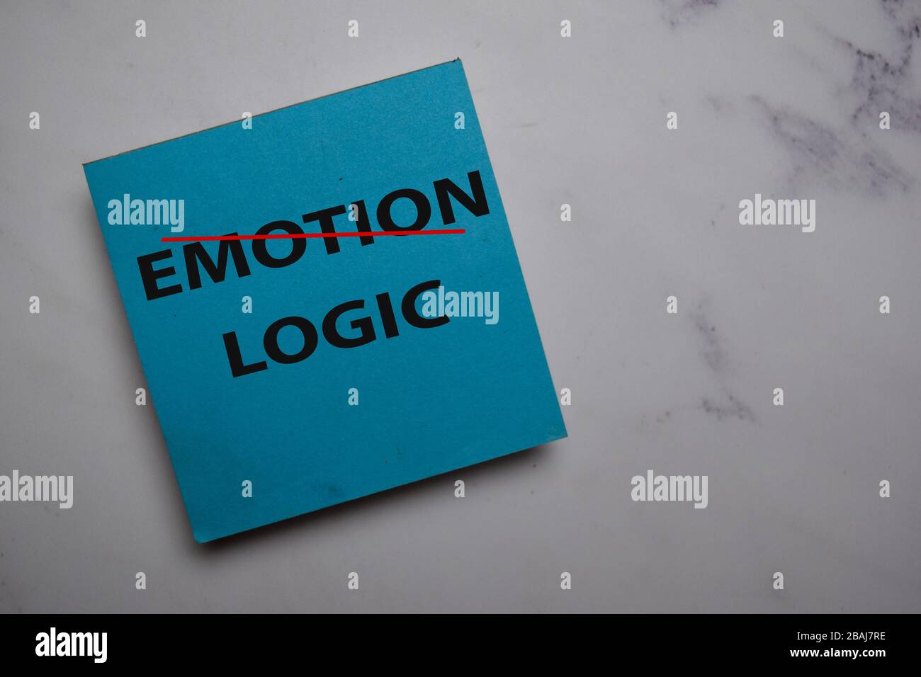 Emotion Vs Logic write on sticky note isolated on Office Desk Stock ...