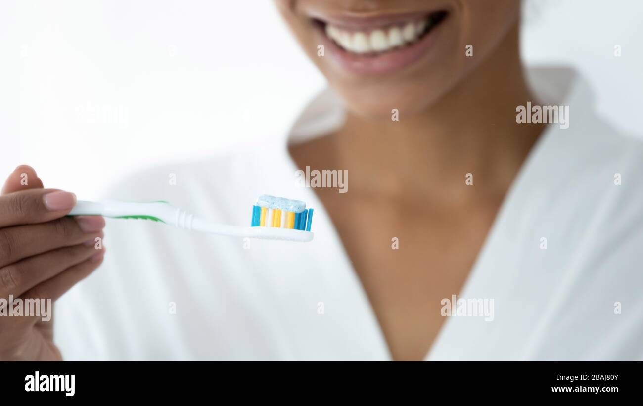 Closeup image african woman holding toothbrush with toothpaste Stock ...