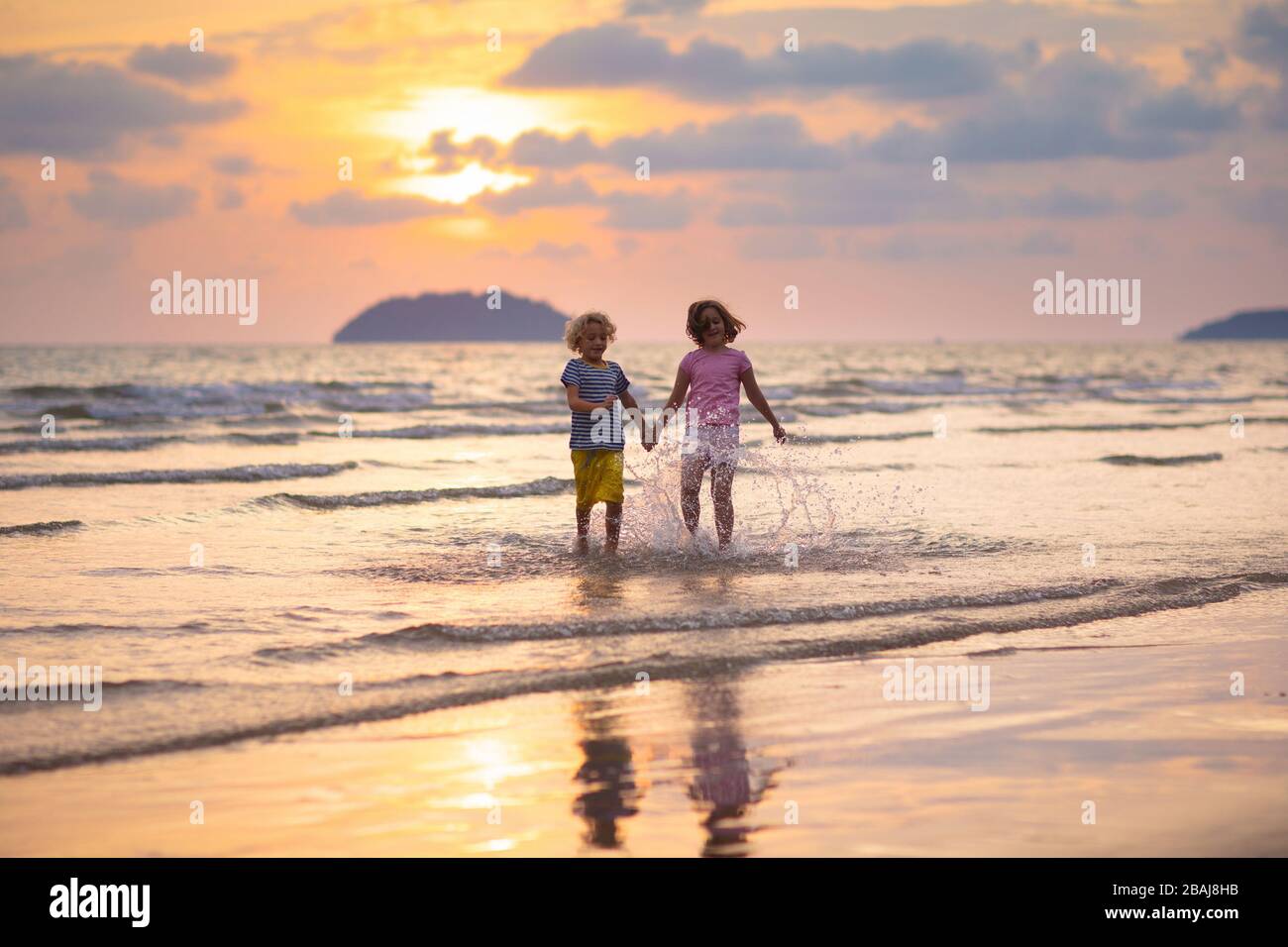 Child Playing In The Waves High Resolution Stock Photography and Images ...