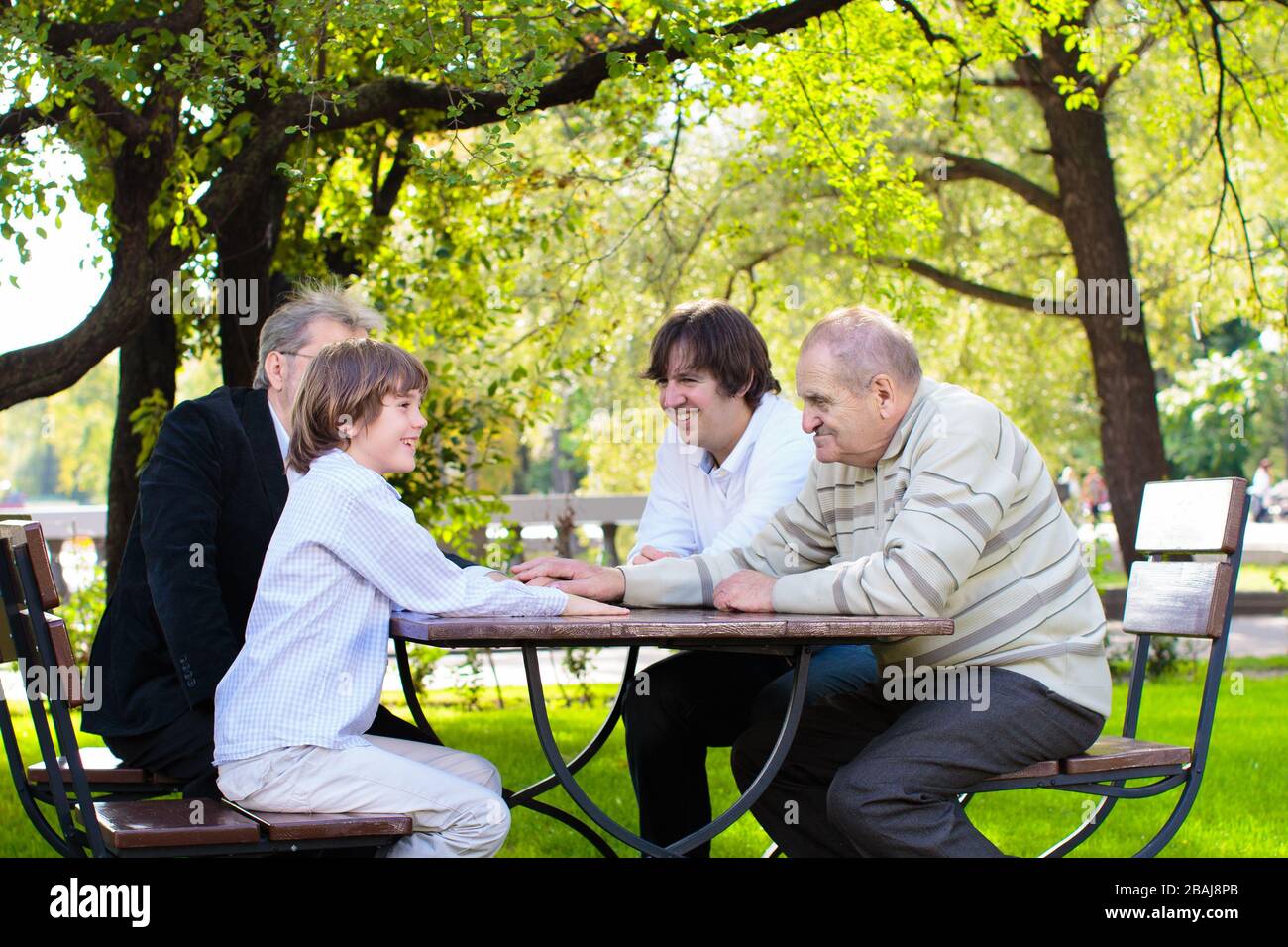 Grandfather, father and kids. Four generations of men. Great ...