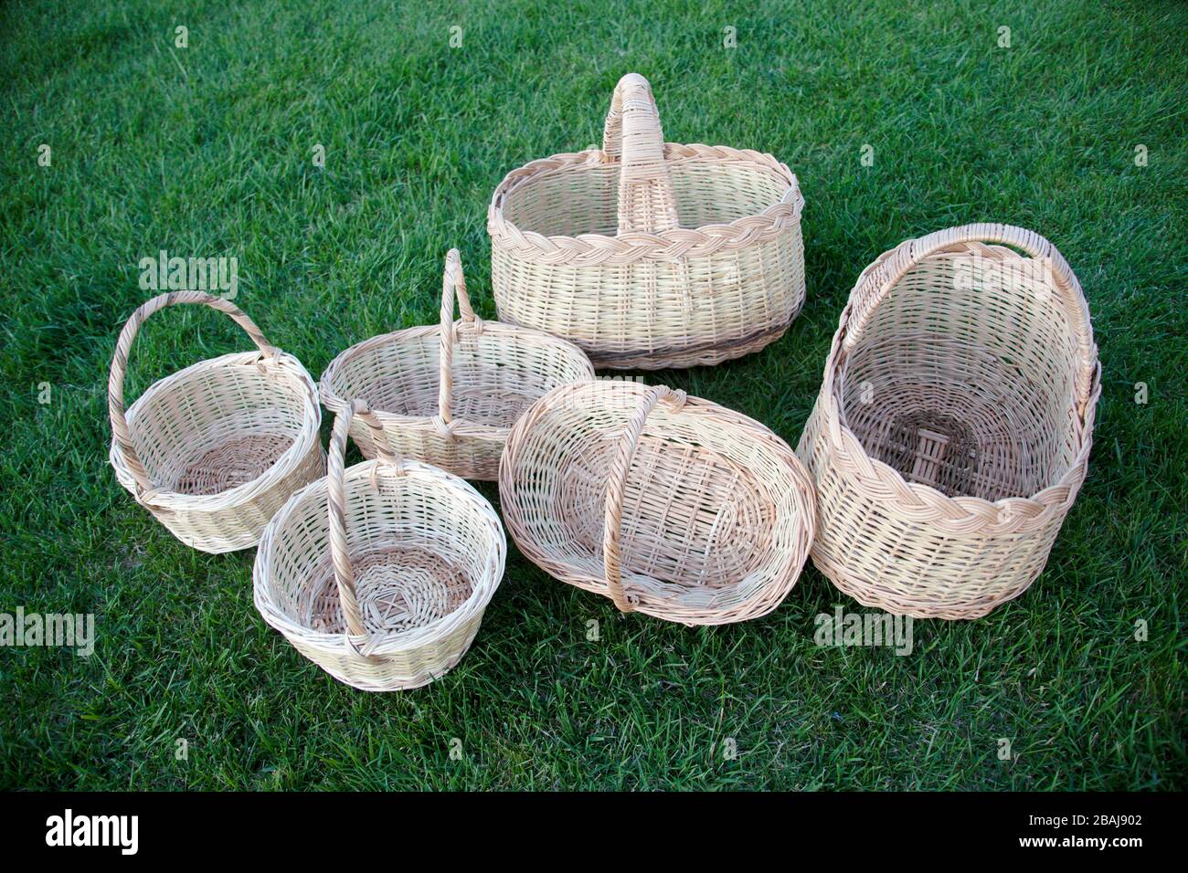 empty baskets on grass background Stock Photo - Alamy