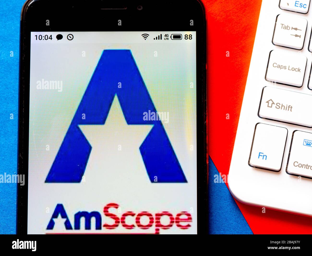 In this photo illustration AmScope logo is seen displayed on a ...