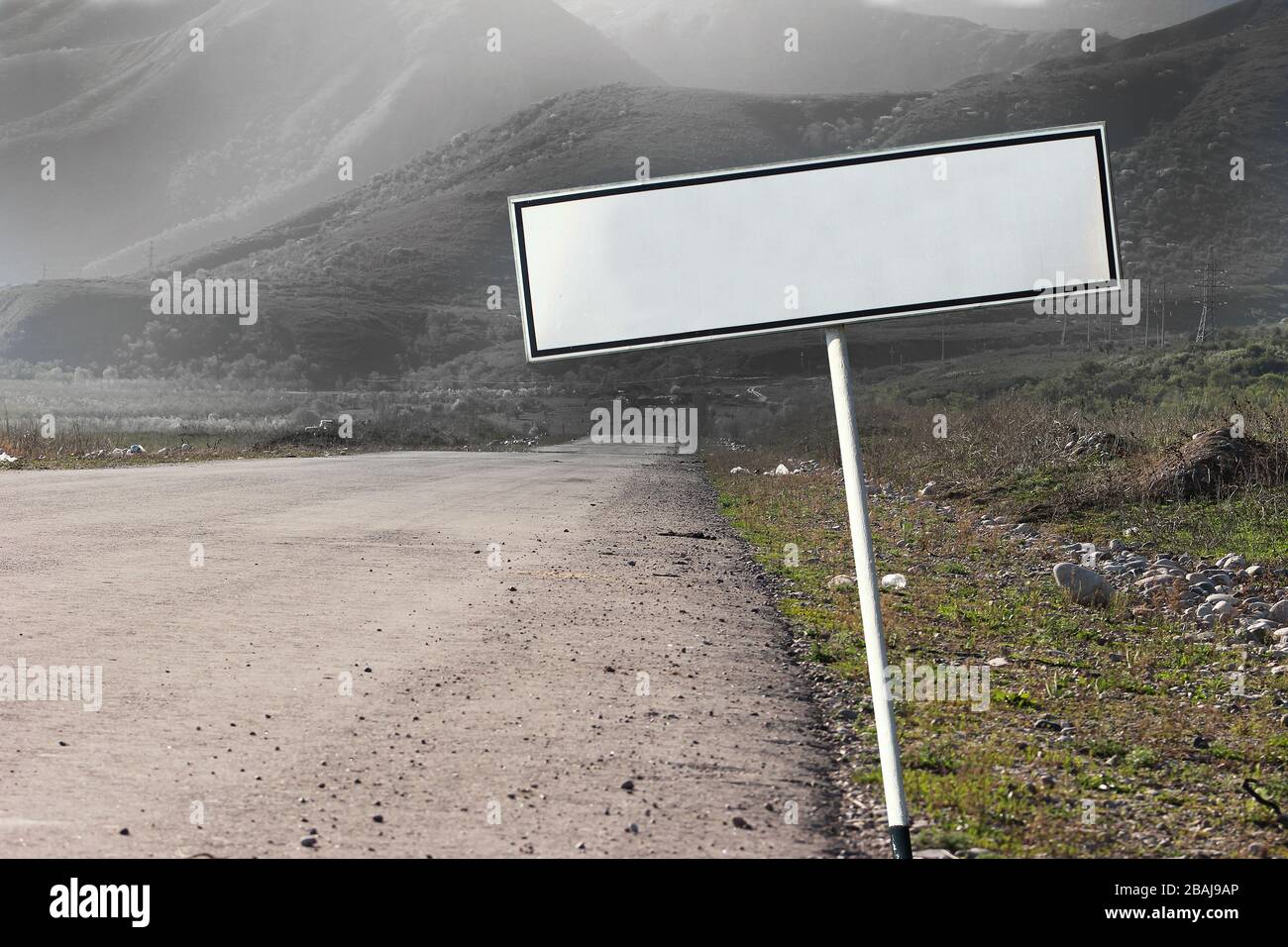 Empty blank road sign concept. The path extending into a gloomy ...