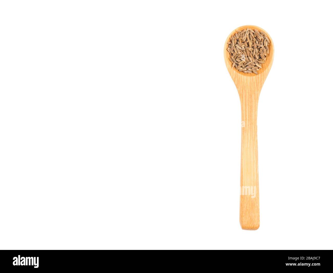 Spice cumin (jeera) in wooden spoon isolated on white Stock Photo - Alamy