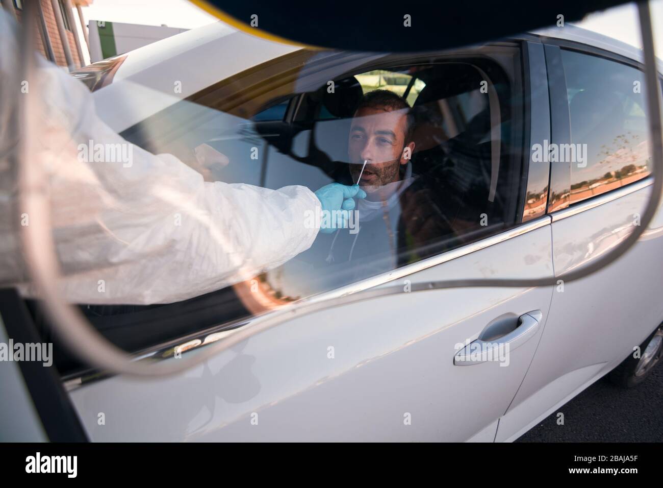 Man wearing an NBC personal protective equipment (ppe) suit, gloves ...
