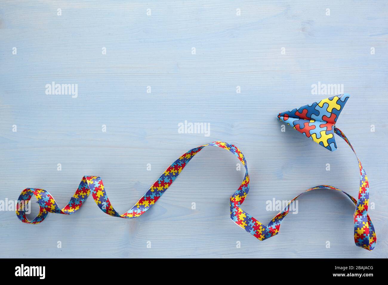 Autism awareness day or month. Paper plane in origami style with autism ...