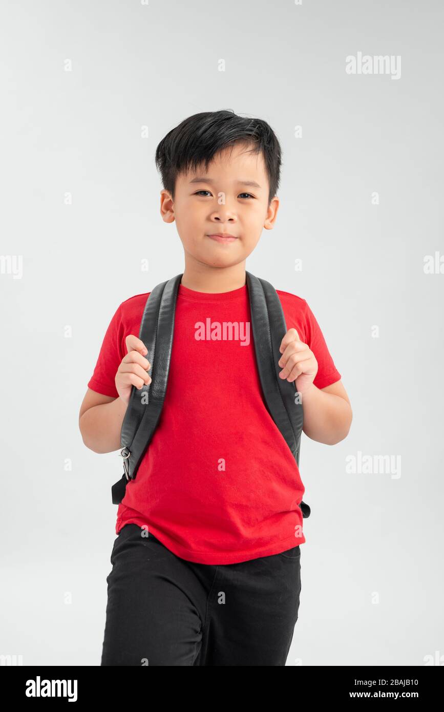 portrait of a school boy with backpack isolated against white ...