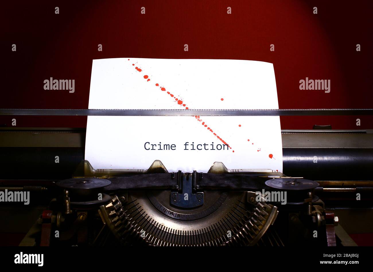 Typewriter spelling crime fiction on paper with blood splashes Stock ...