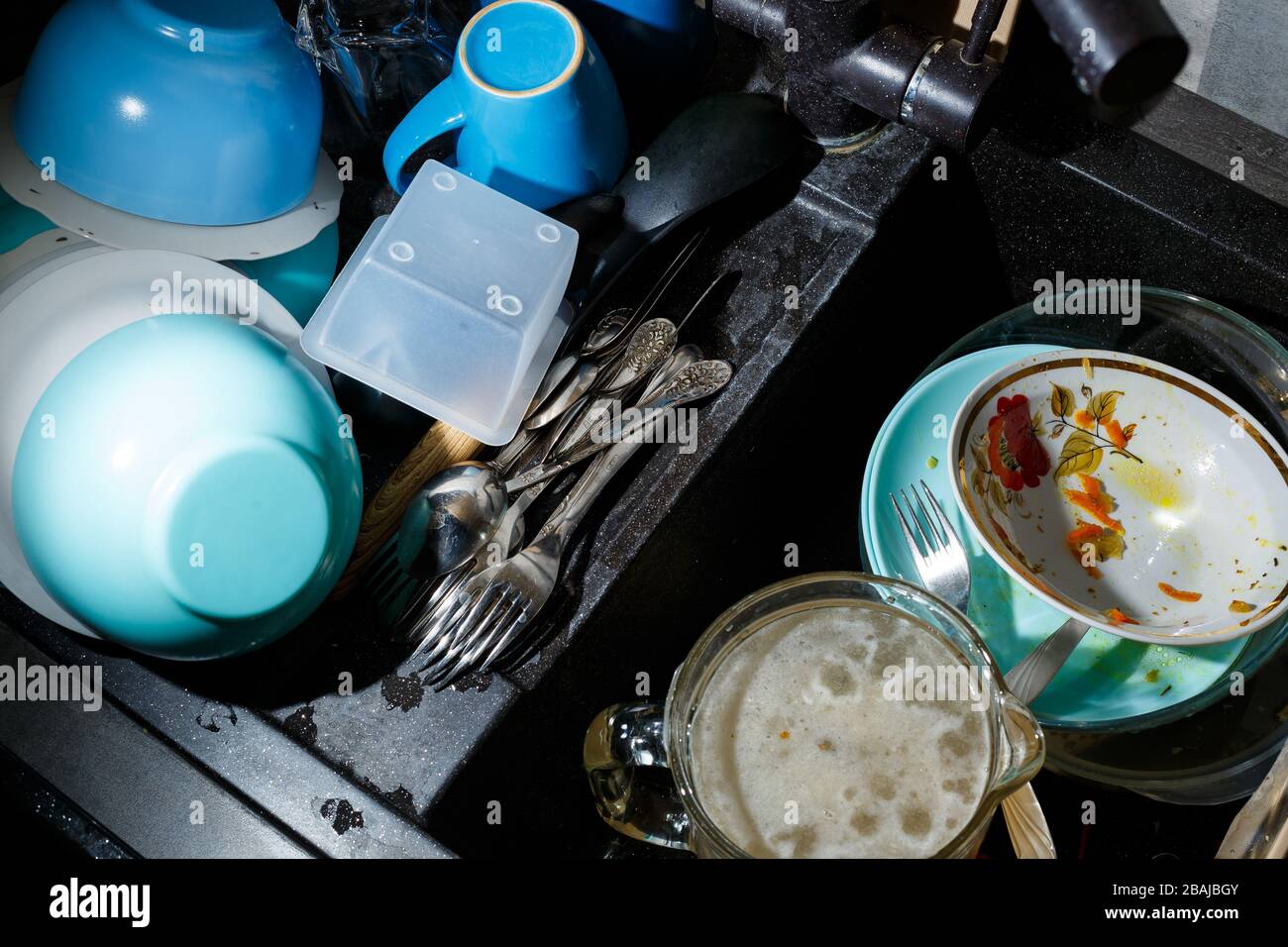 Dirty dishes fill sink hi-res stock photography and images - Alamy