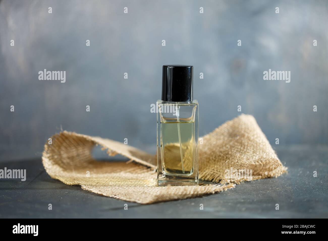 perfume bottle with black cap Stock Photo - Alamy