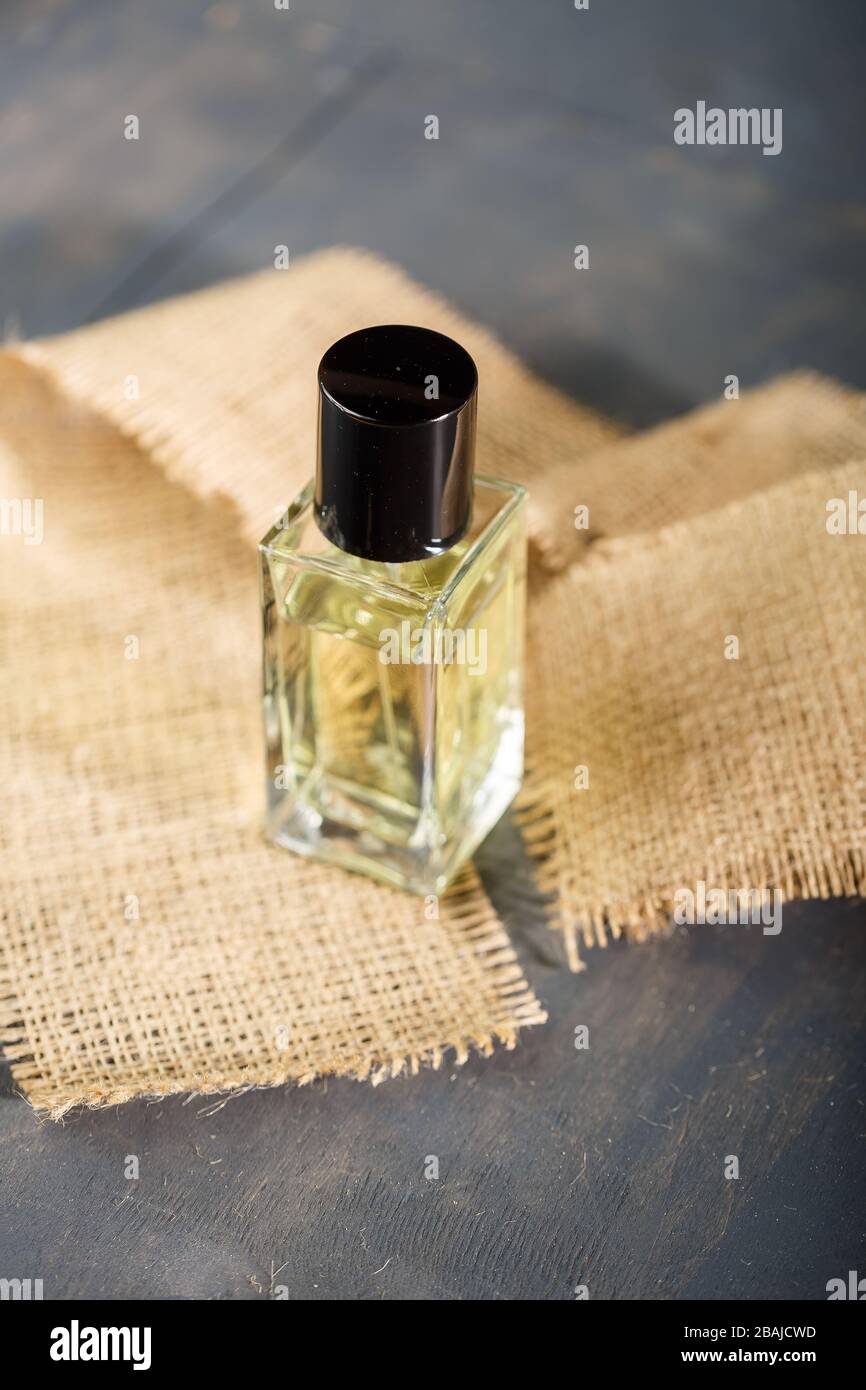 perfume bottle with black cap Stock Photo - Alamy