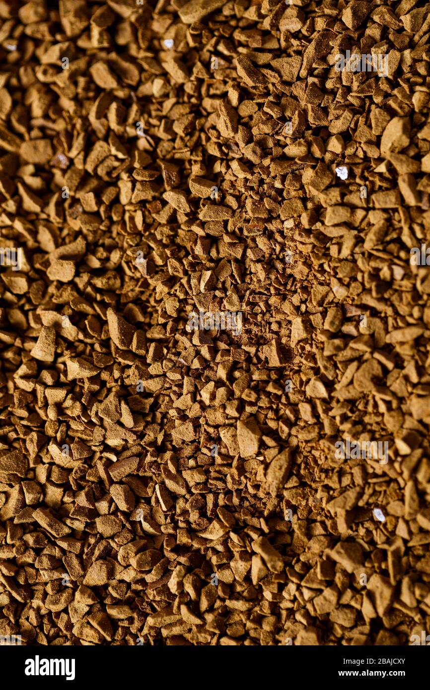 Granules of instant coffee background Stock Photo - Alamy