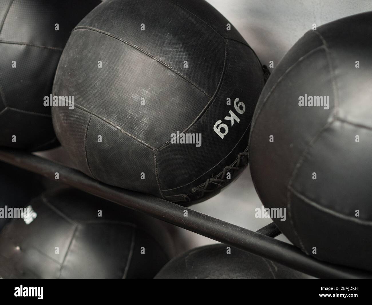 Black heavy balls in a gym Stock Photo - Alamy