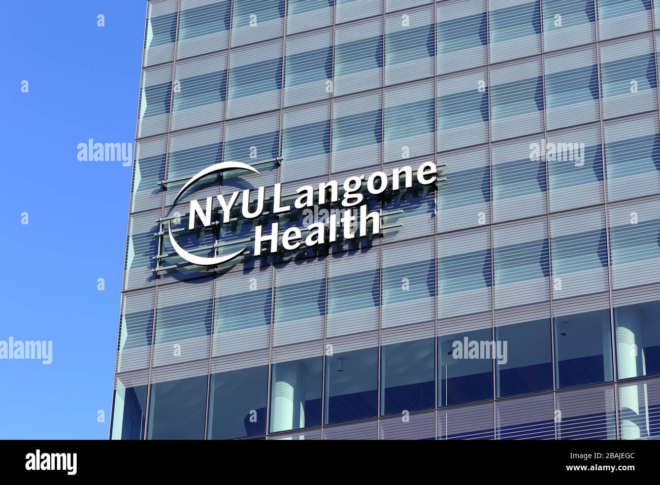 A sign for NYU Langone Health on a hospital building in New York, NY ... A sign for NYU Langone Health on a hospital building in New York, NY ...