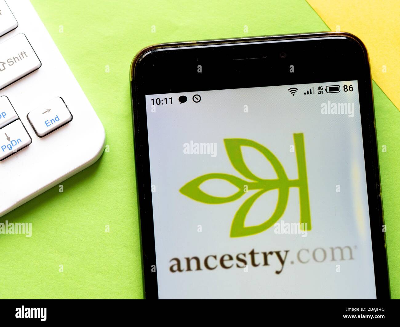 In this photo illustration an Ancestry.com logo seen displayed on a ...