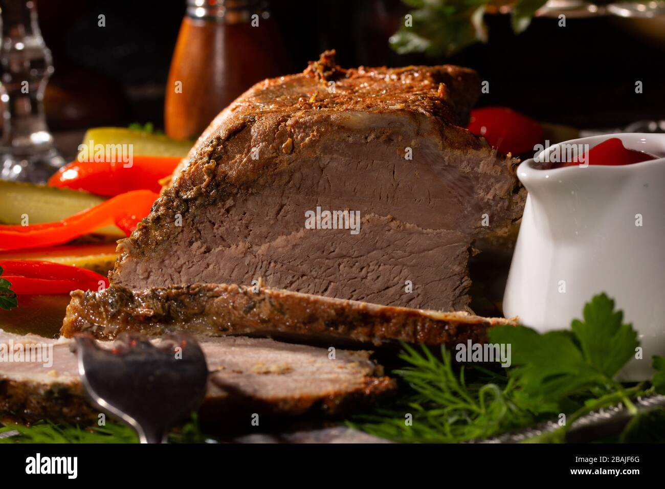 Fresh baked meat with herbs and vegetables Stock Photo - Alamy