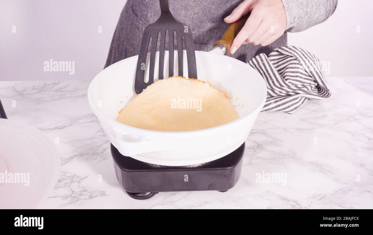 Making crepes in a small frying pan over medium heat Stock Photo - Alamy
