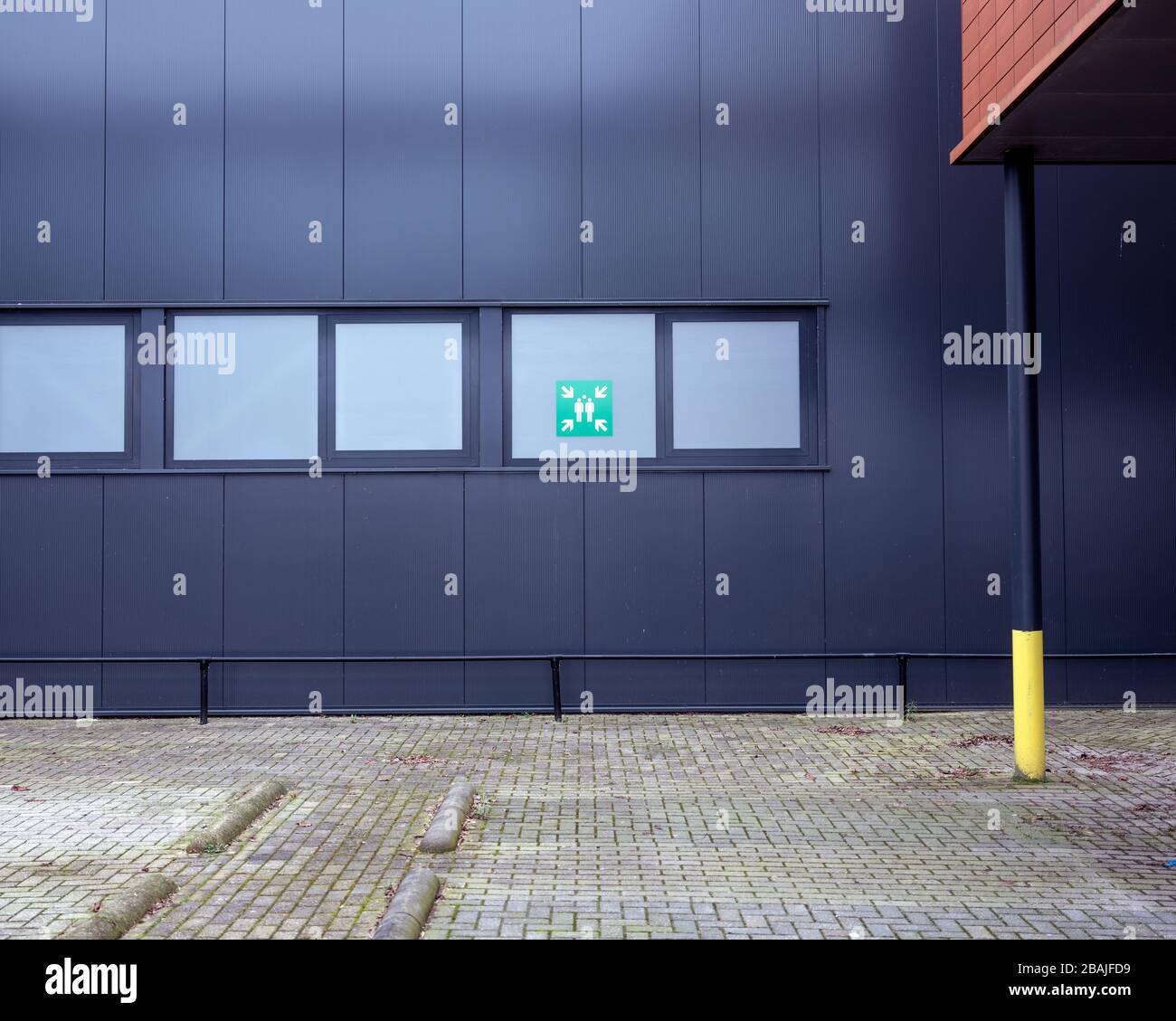 White assembly point sign on hi-res stock photography and images - Alamy