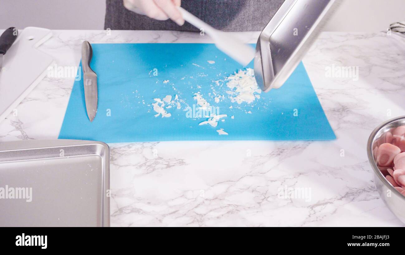 Step by step. Trimming excess chocolate with a small kitchen knife from ...