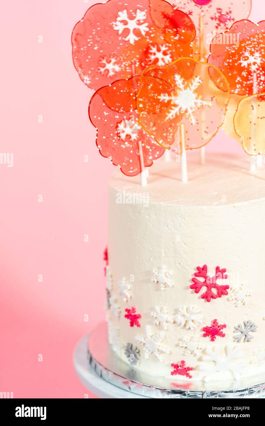 Tall round cake with Italian buttercream frosting decorated with ...