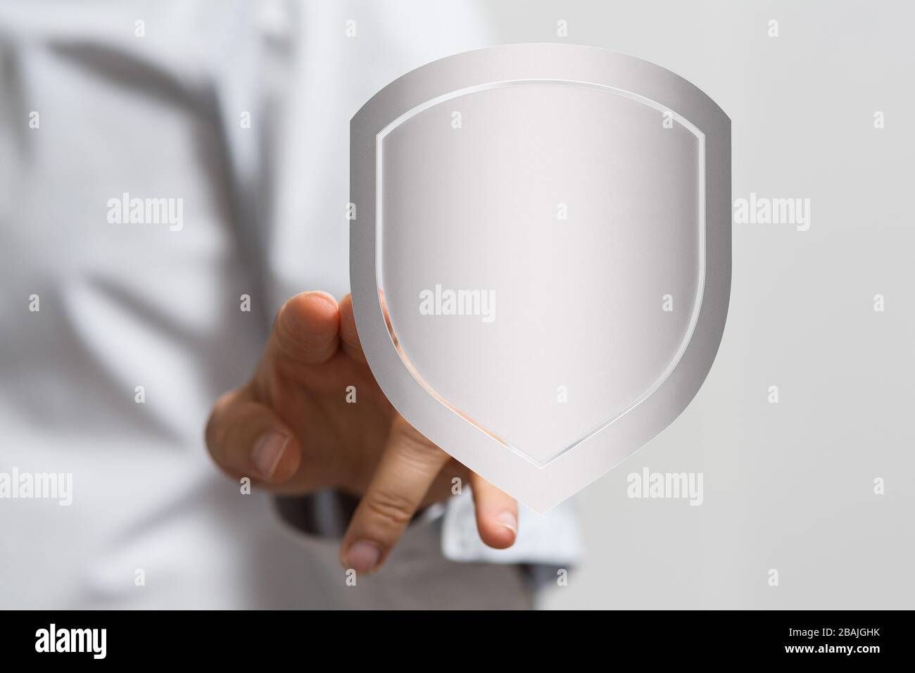 A shield protection concept holding in hand digital Stock Photo - Alamy