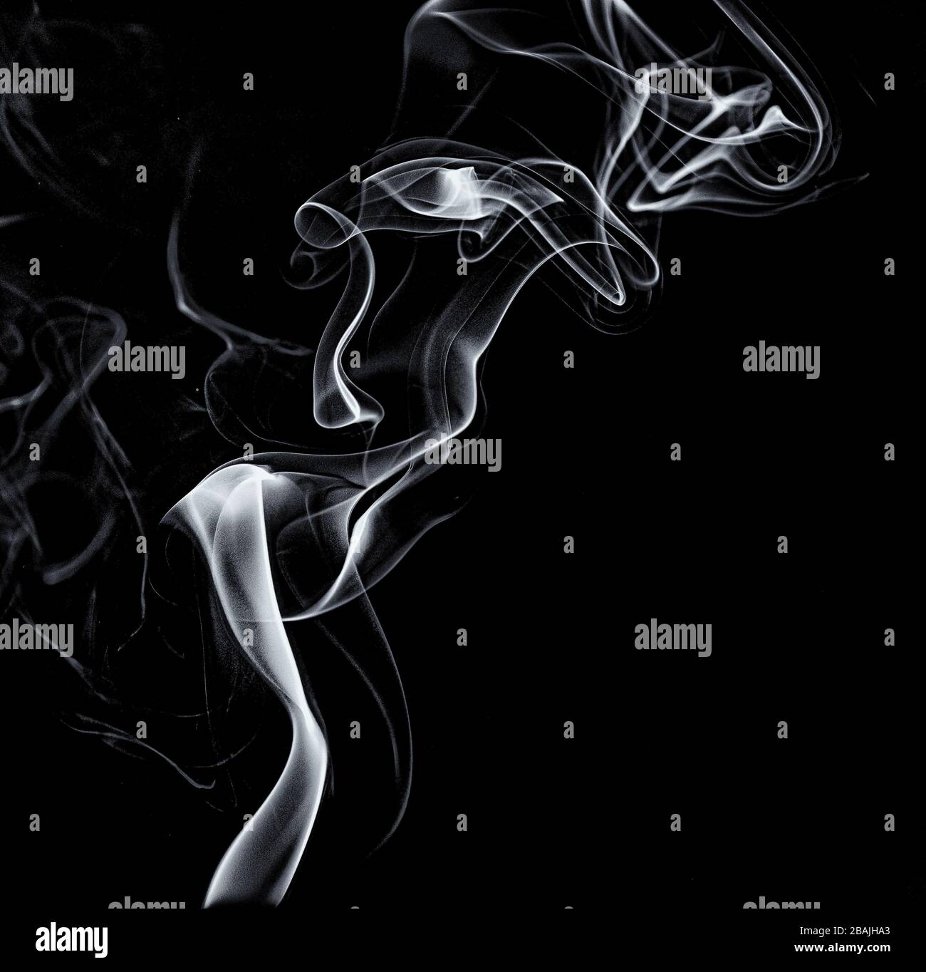 Wispy smoke against a black backdrop Stock Photo - Alamy