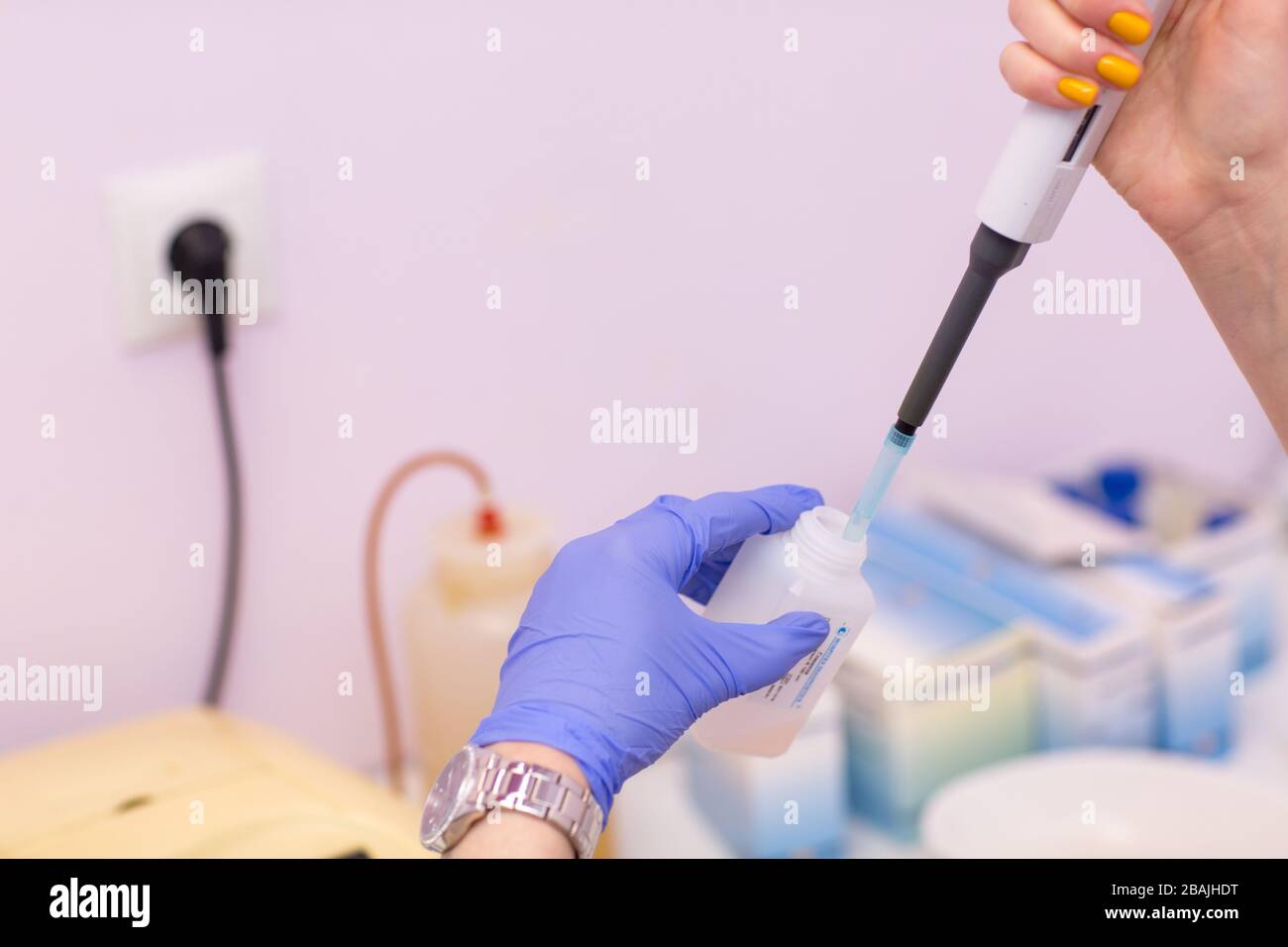 Laboratory assistant in medical laboratory holds test tube with blood ...