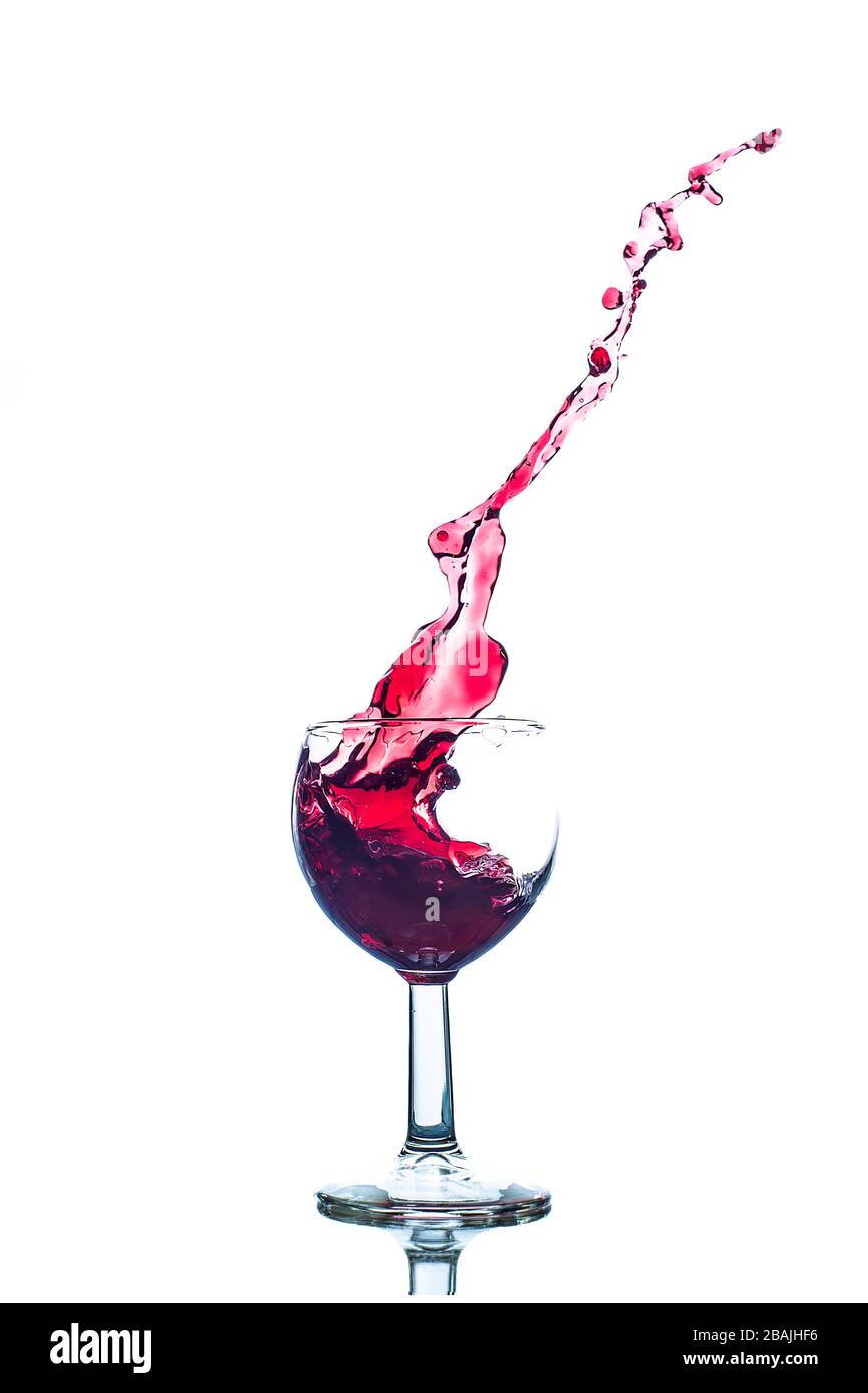 glass splash red wine with white background celebration Stock Photo - Alamy