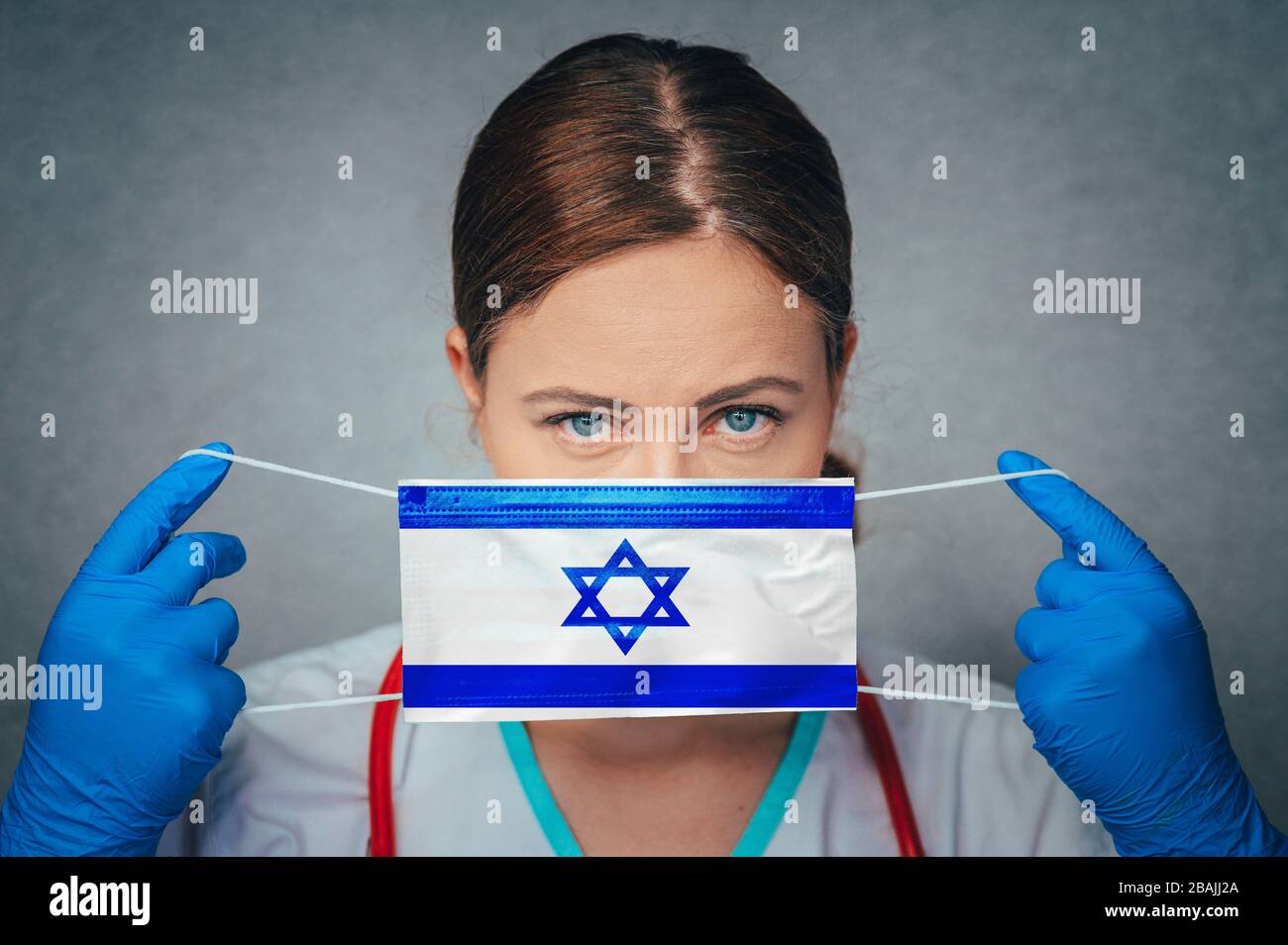 Coronavirus in Israel Female Doctor Portrait hold protect Face surgical ...