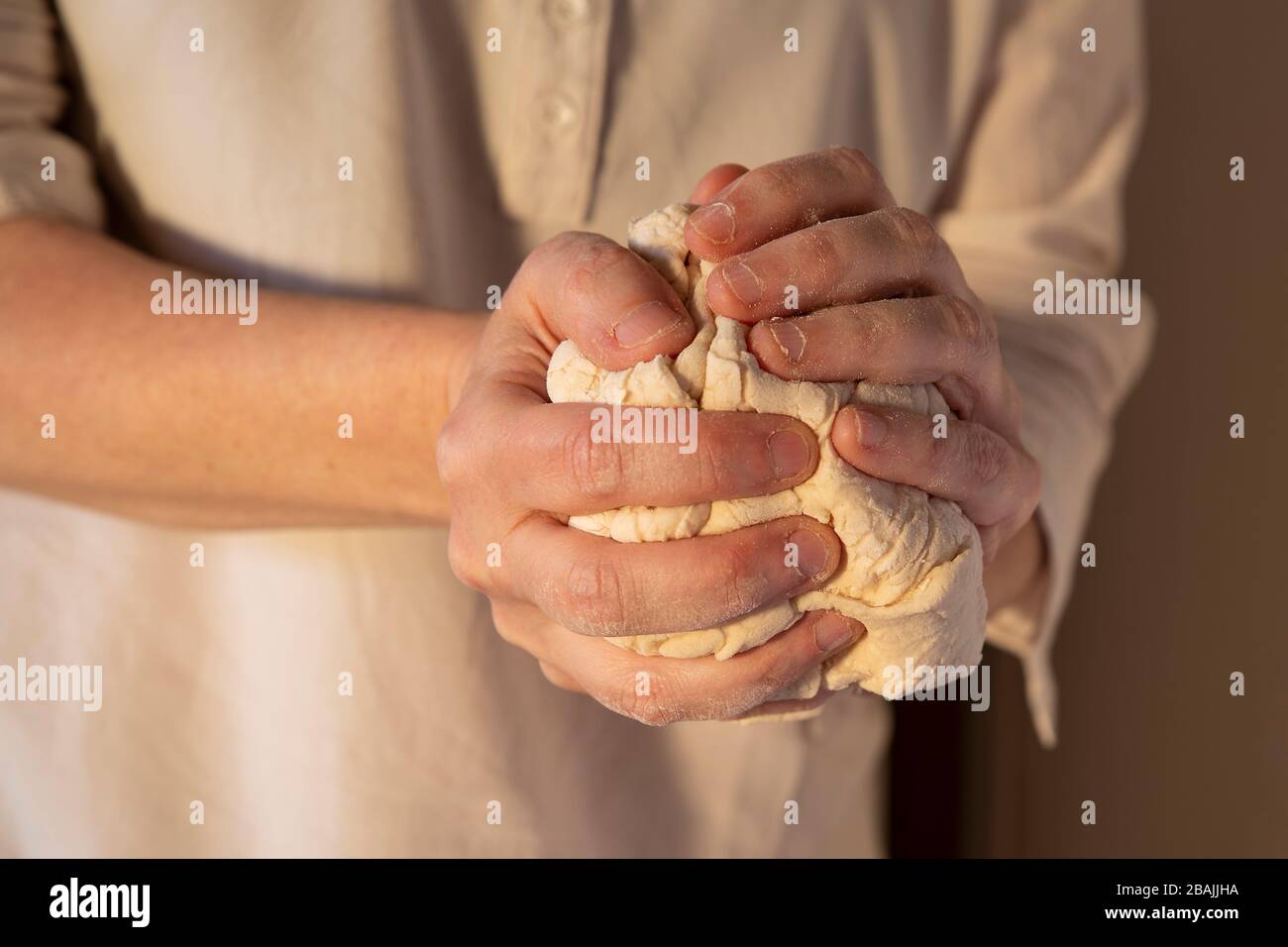 Close-up of hands kneading bread dough Stock Photo - Alamy
