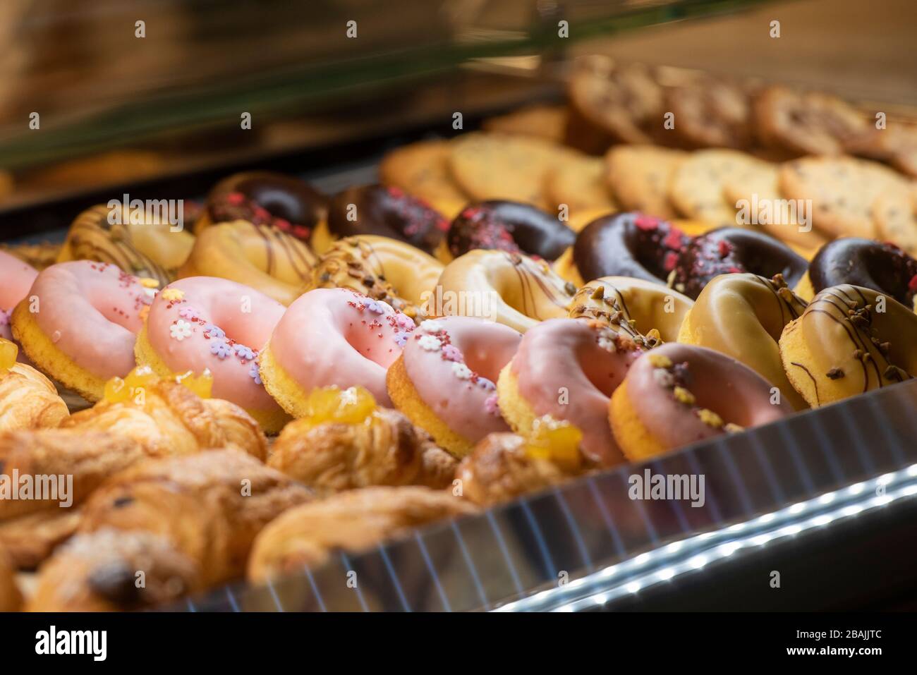 fresh assorted donuts in confectionery Stock Photo - Alamy