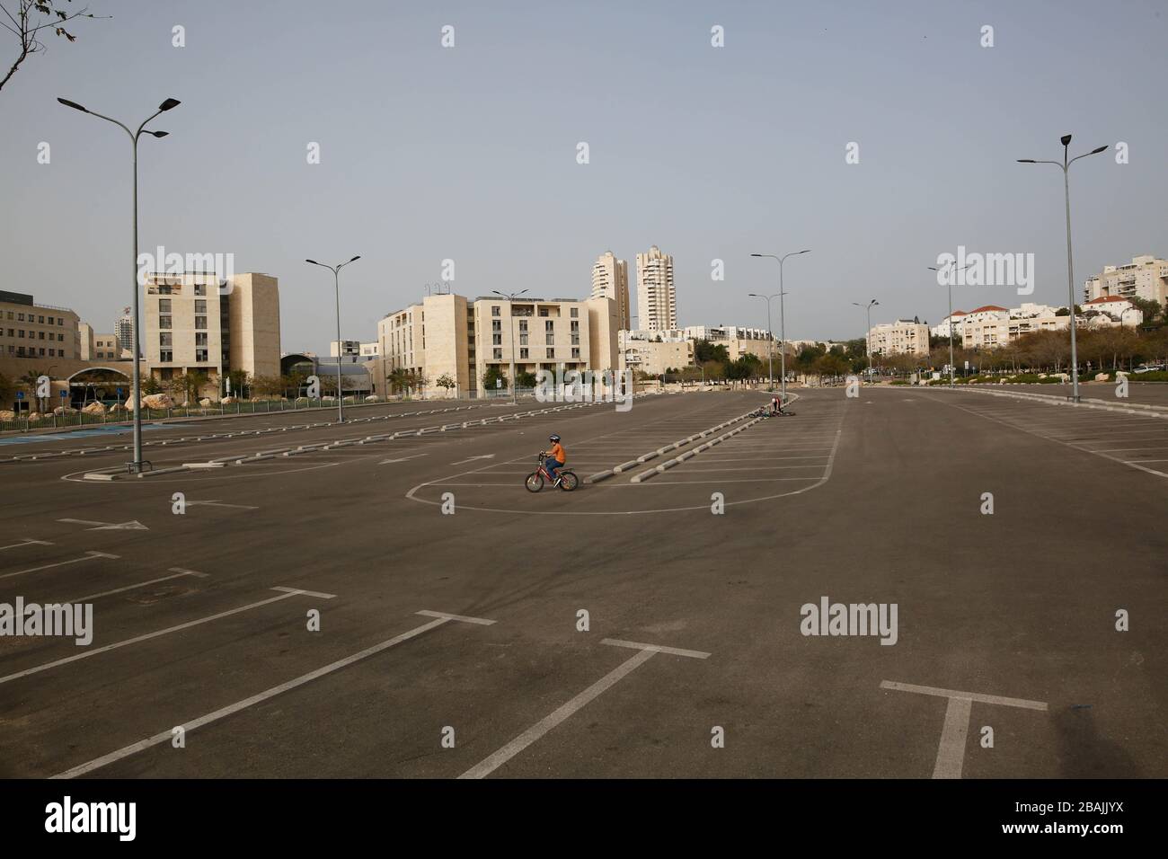 Modiin. 27th Mar, 2020. An empty parking lot is seen in the central ...