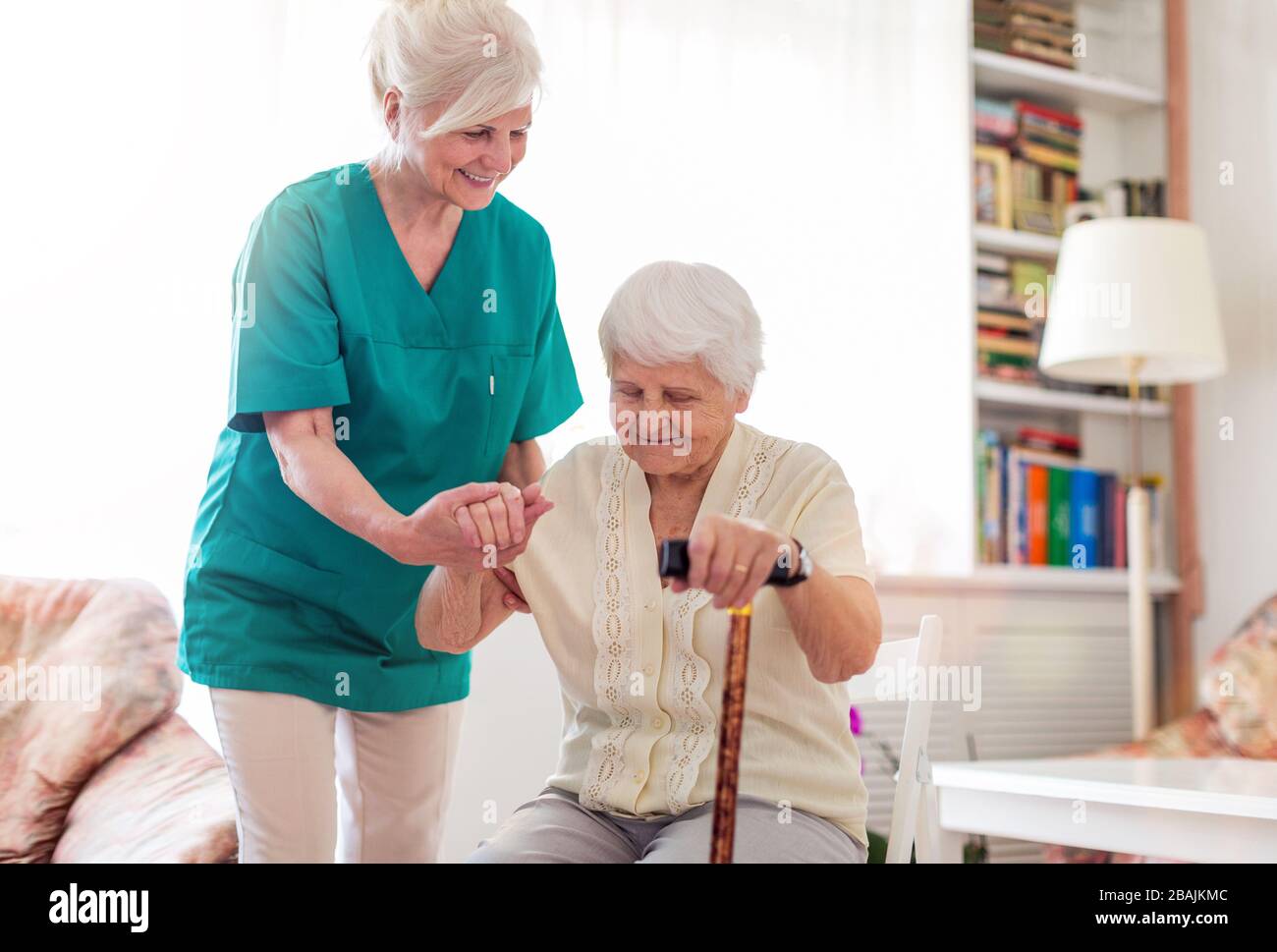 Home caregiver with senior adult woman Stock Photo - Alamy