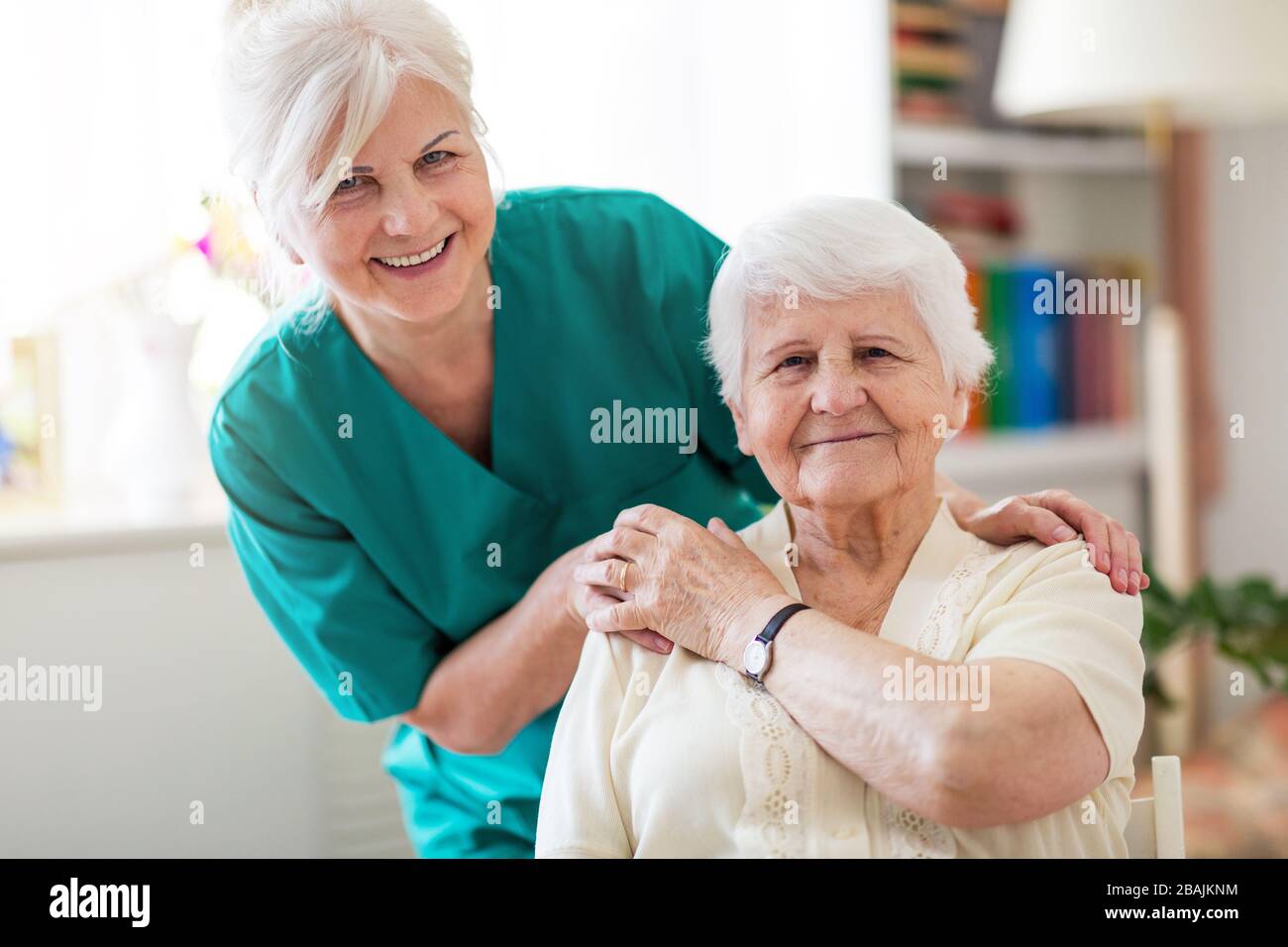 Home caregiver with senior adult woman Stock Photo - Alamy