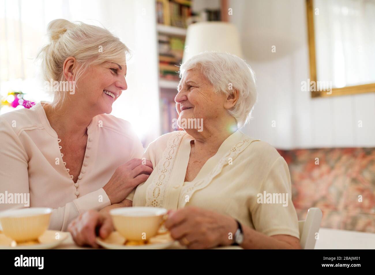 Senior woman spending quality time with her daughter Stock Photo - Alamy