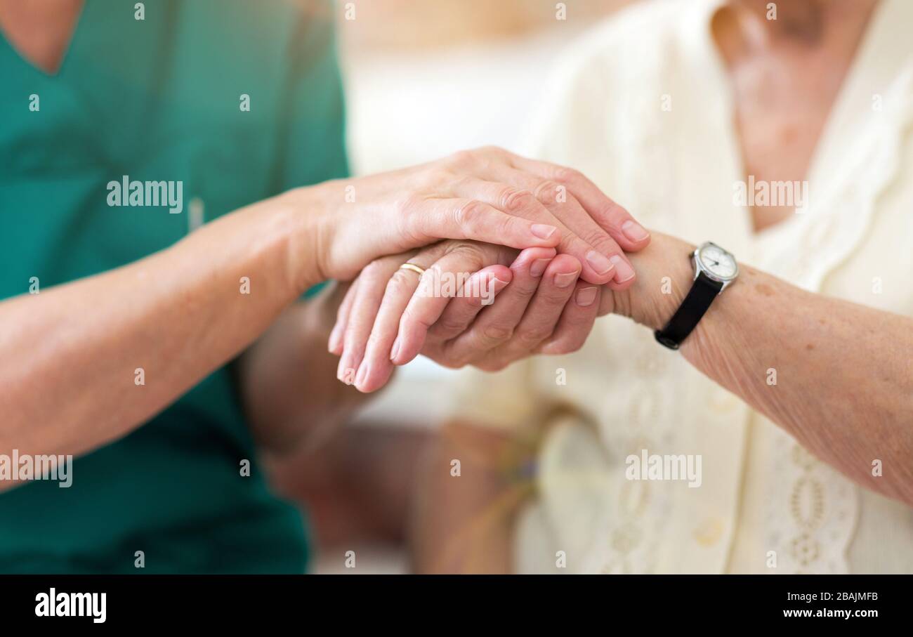 Home caregiver with senior adult woman Stock Photo - Alamy