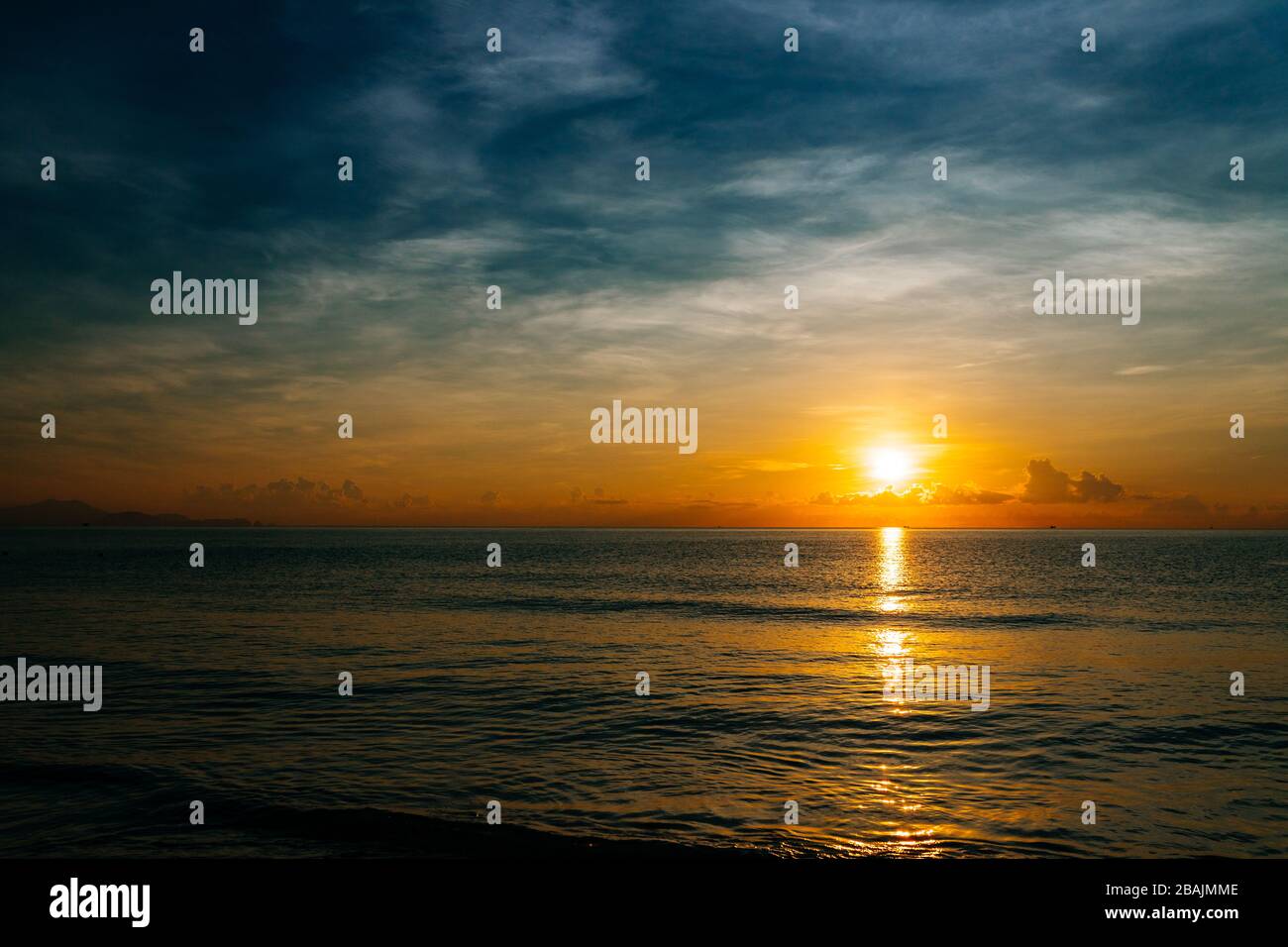 Beautiful sunrise, sunset of the sun through the clouds, the rays of ...