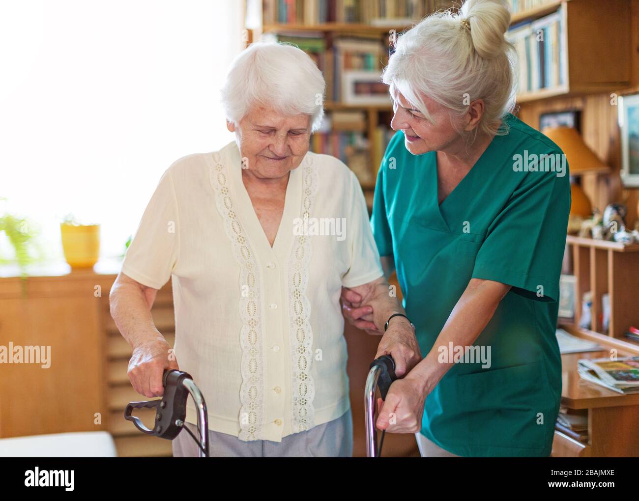 Home caregiver with senior adult woman Stock Photo - Alamy