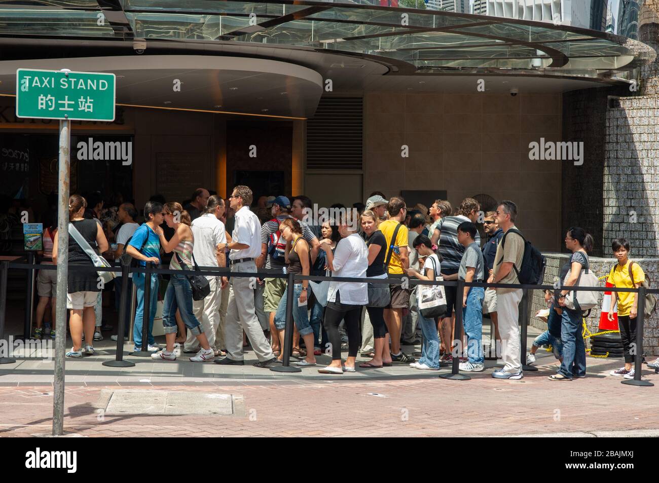 Queue of tourists at the entry to the Peak Tram, the funicular railway ...