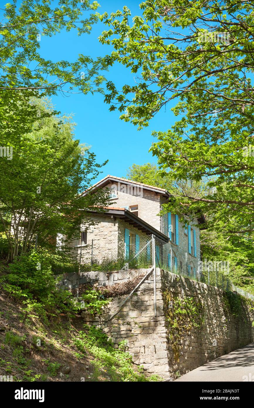 country house in the wood, view from the road, outdoors Stock Photo - Alamy