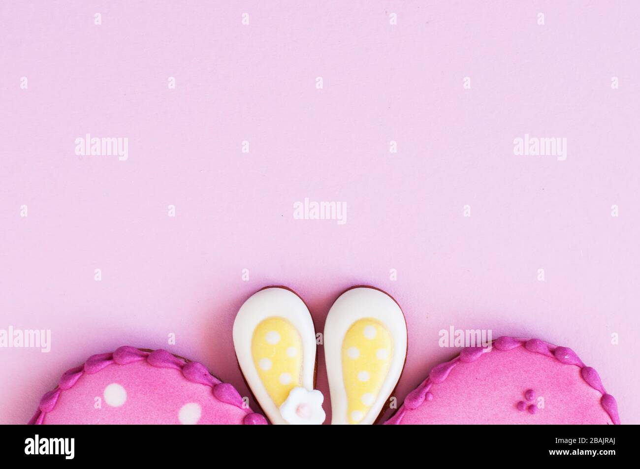 Easter background concept. Polka dot easter egg and bunny ear cookies ...