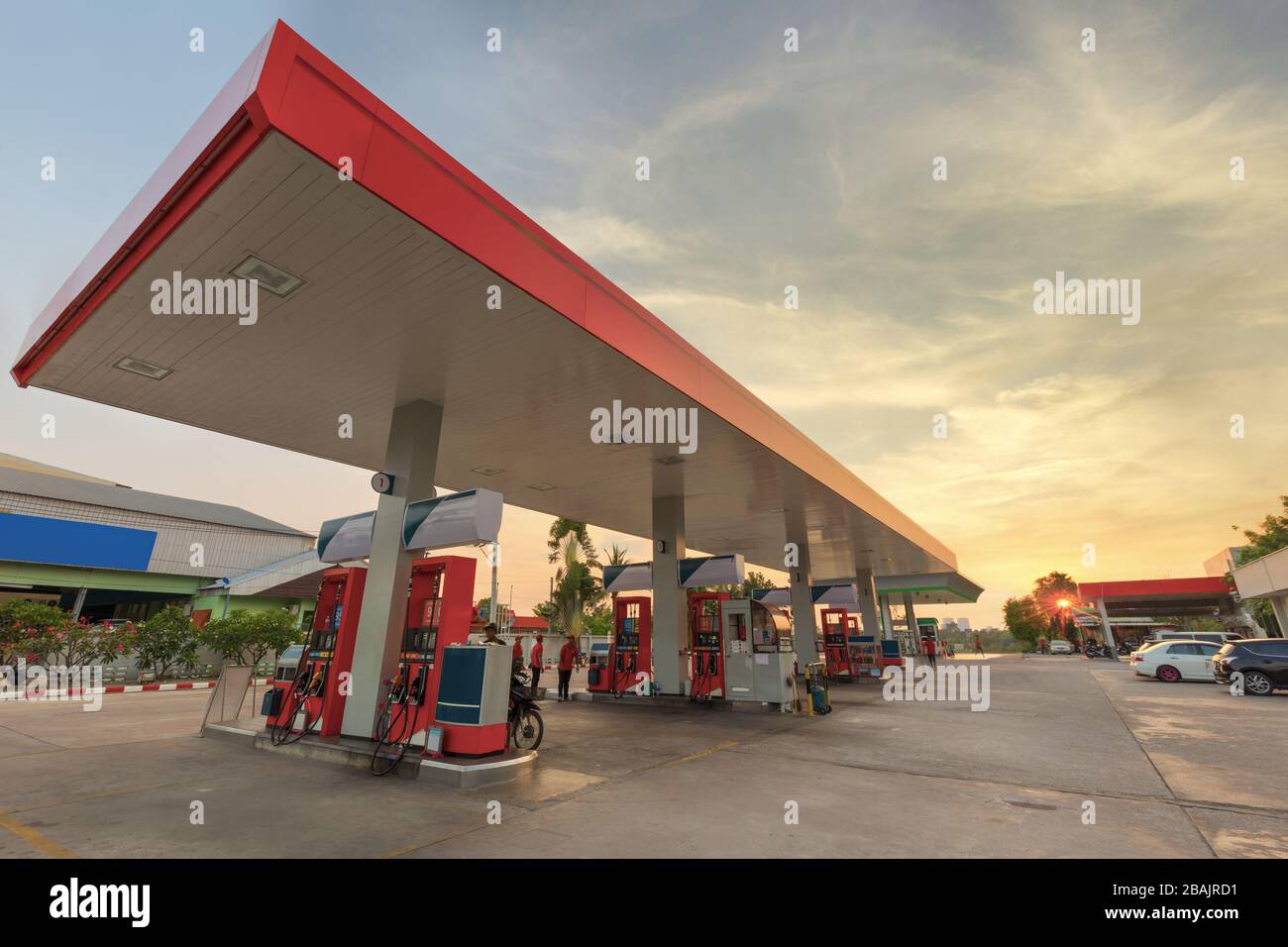 Gas station at sunset Stock Photo - Alamy